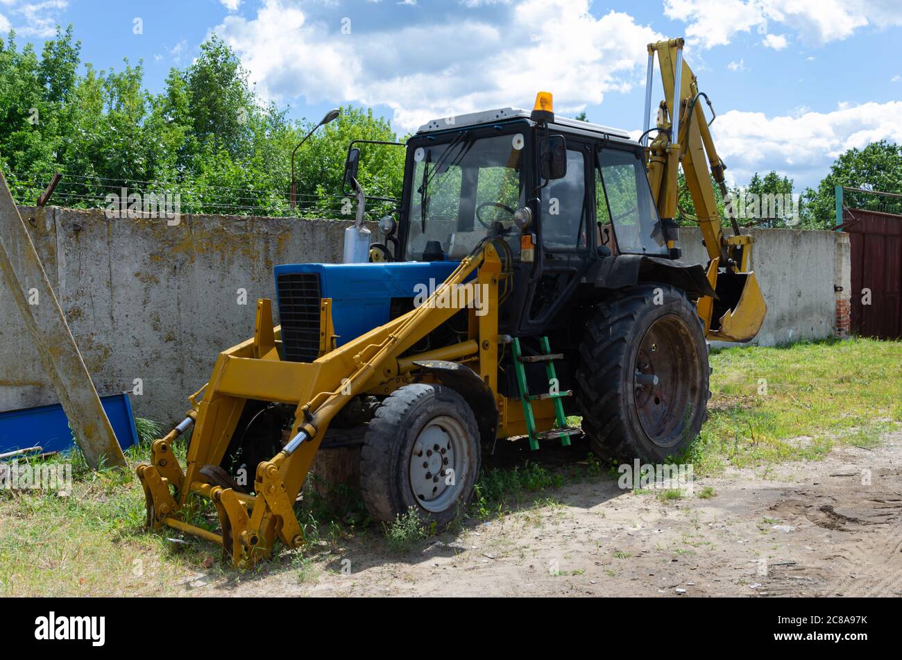 Old rusty tractor's flat back tire Stock Photo - Alamy