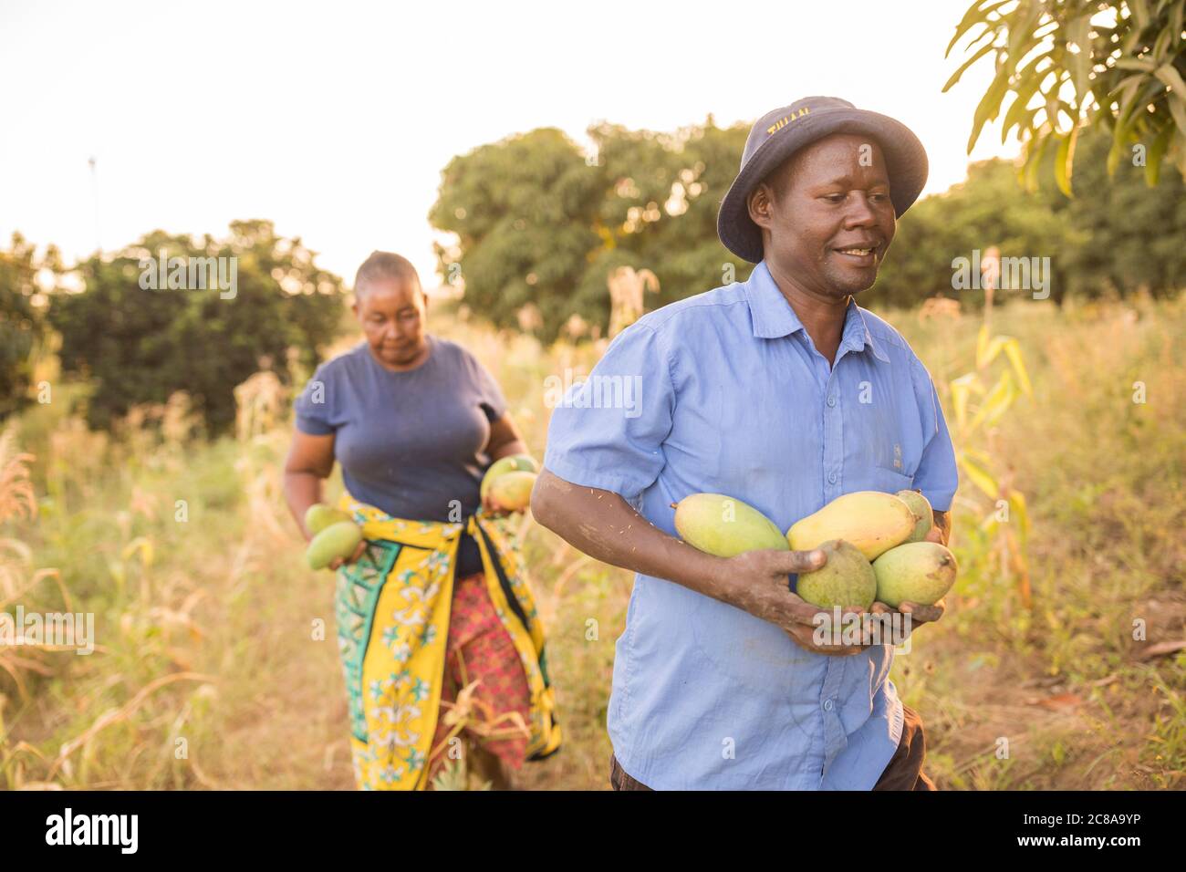 Woman with a mango hi-res stock photography and images - Alamy