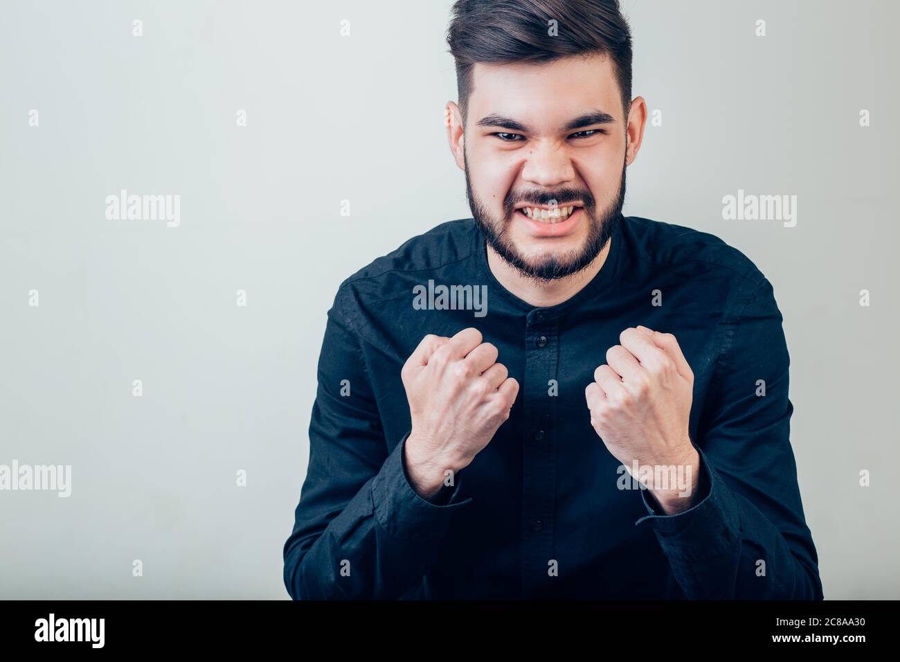 Angry aggressive man shouting out loud with ferocious expression Stock ...