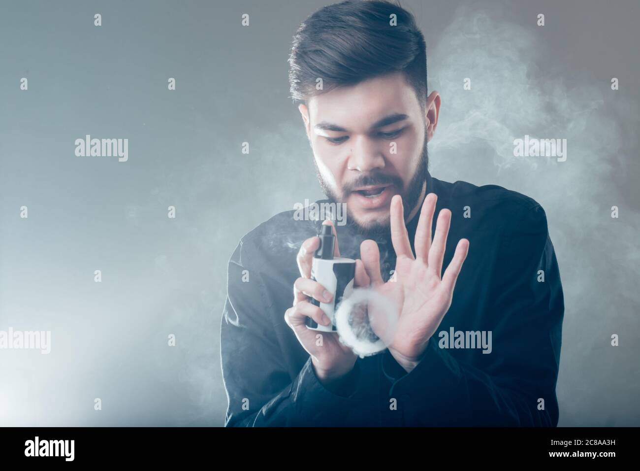 Blowing smoke rings hi-res stock photography and images - Alamy