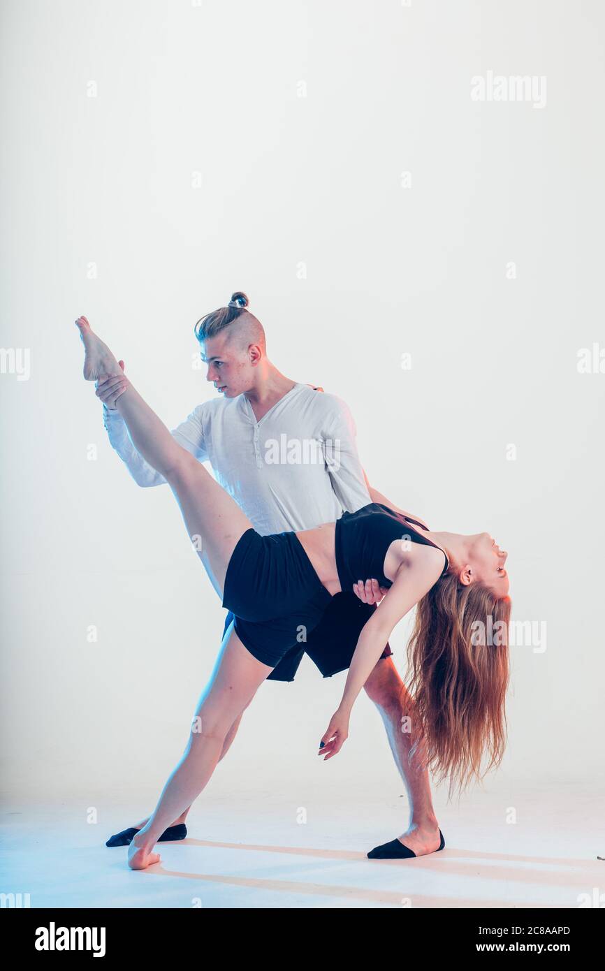 Passionate attractive casual couple dancing. Two modern style beautiful ...