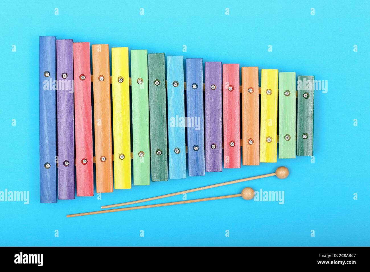 colorful xylophone on blue surface, top view Stock Photo - Alamy