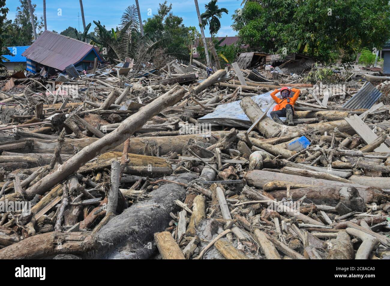 Volunteer resting within the ruins of buildings in the village of Radda ...