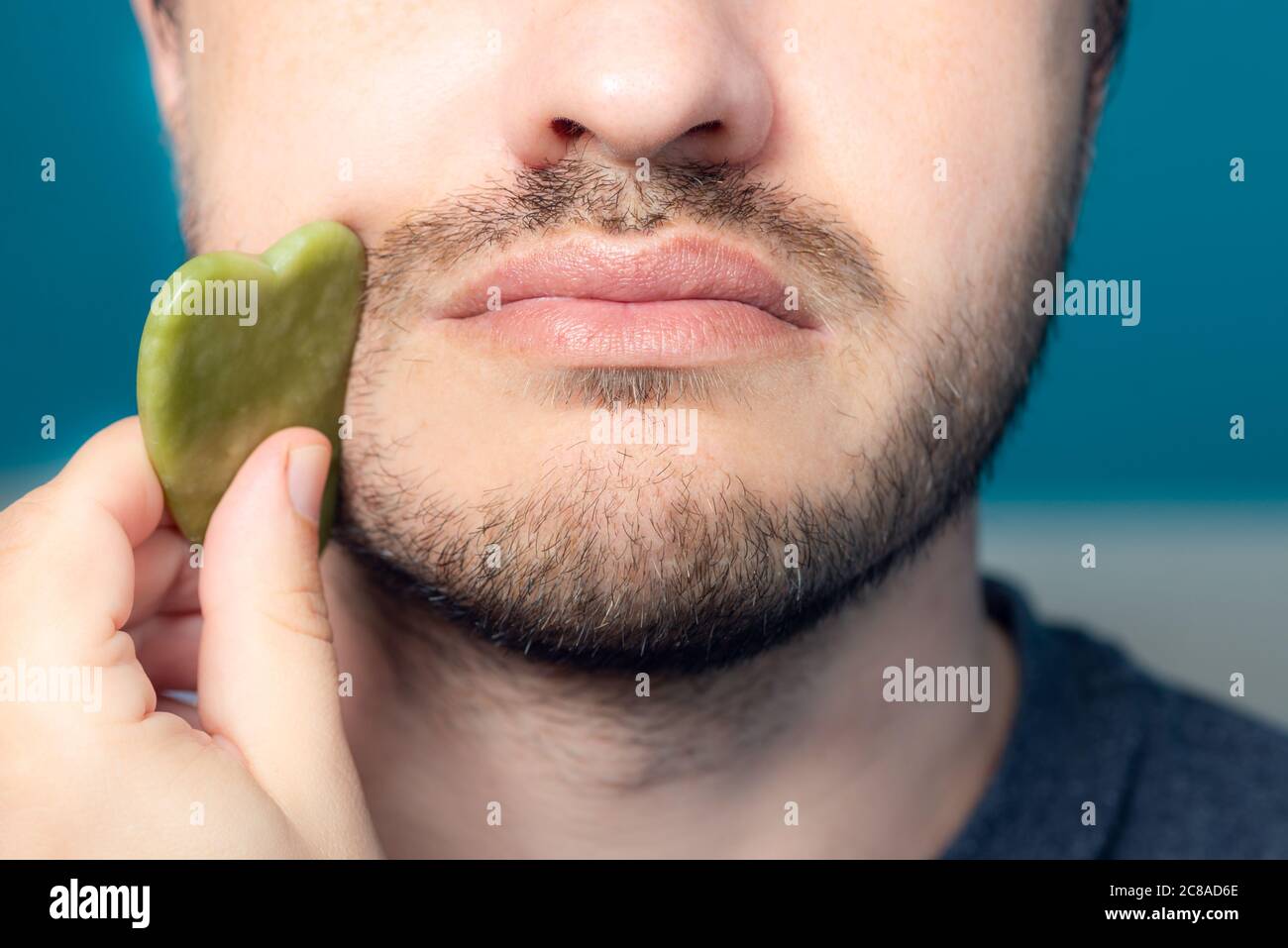 Home facial care using roller hi-res stock photography and images - Alamy