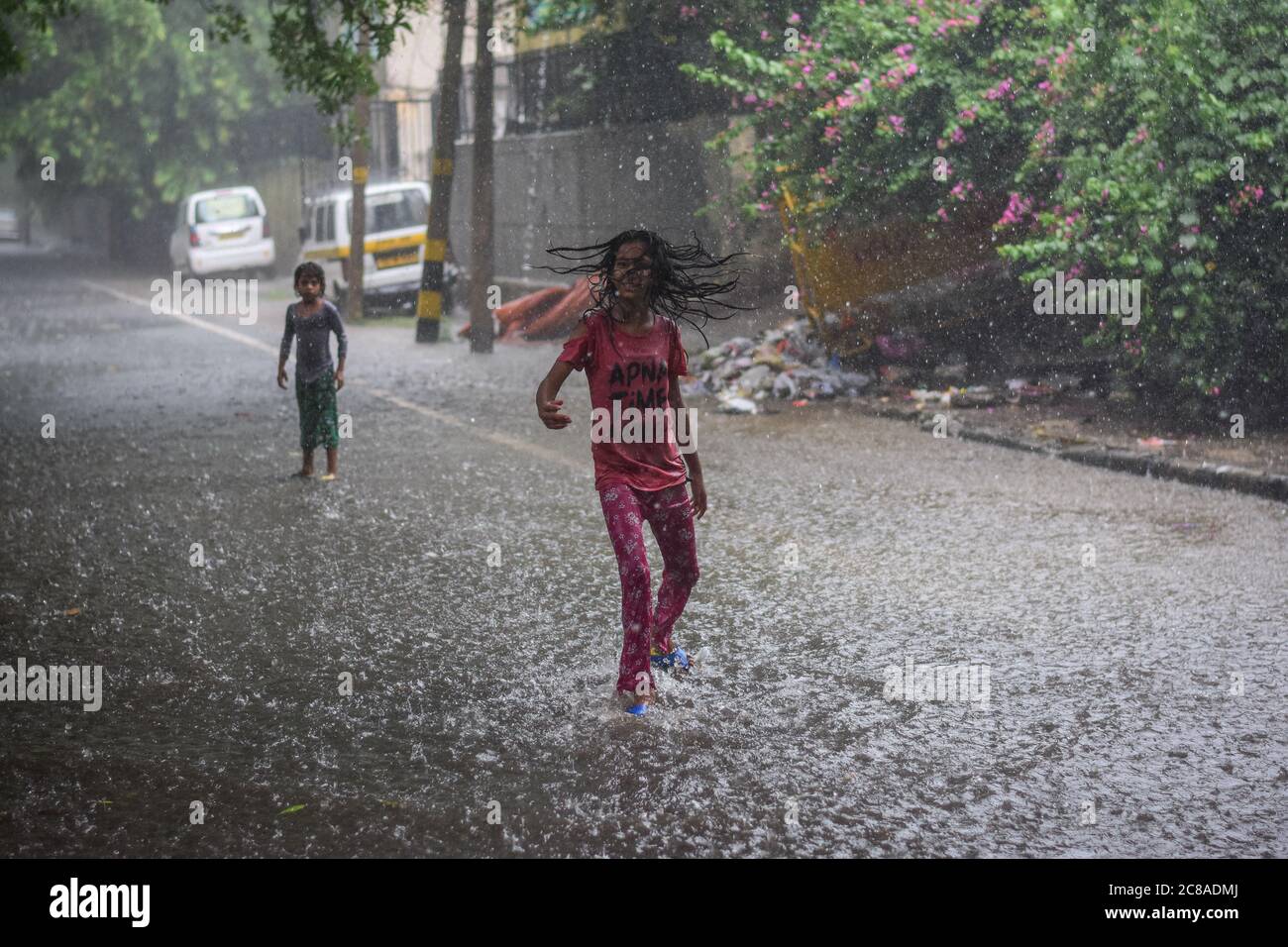 Kids seen playing in the rain, during heavy rainfall in Delhi.Heavy ...