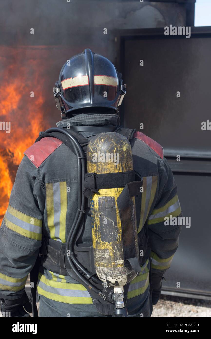 Firefighter putting out fire training station extinguisher backdraft ...