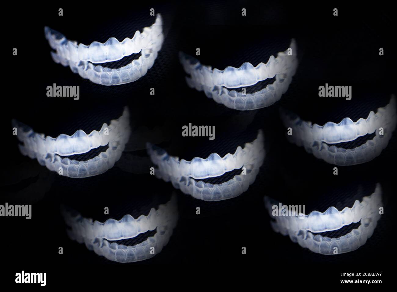 Invisible dental retention splint on black background. No people Stock ...