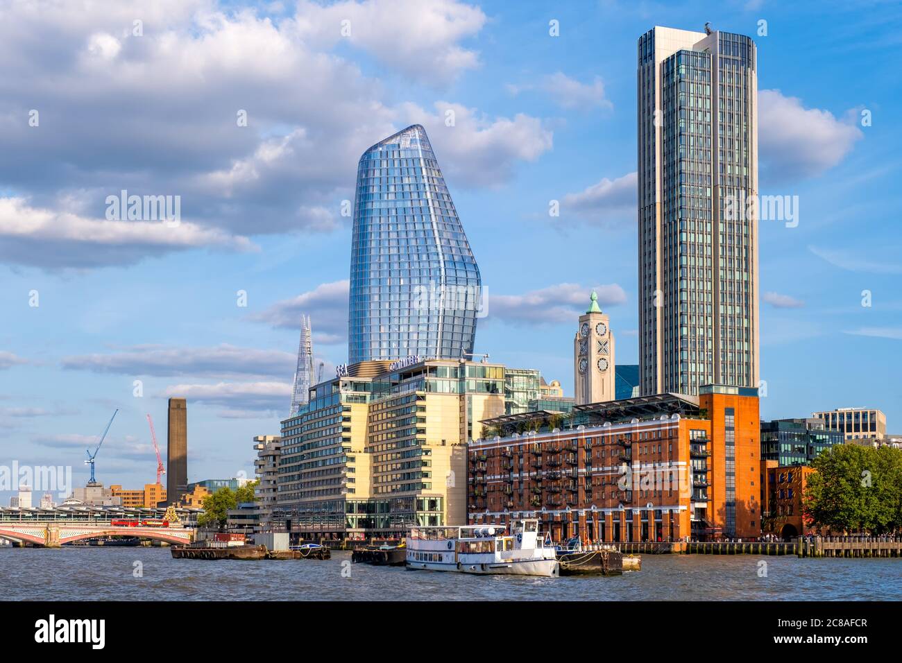 Waterfront apartment buildings and a view of the river Thames in London ...