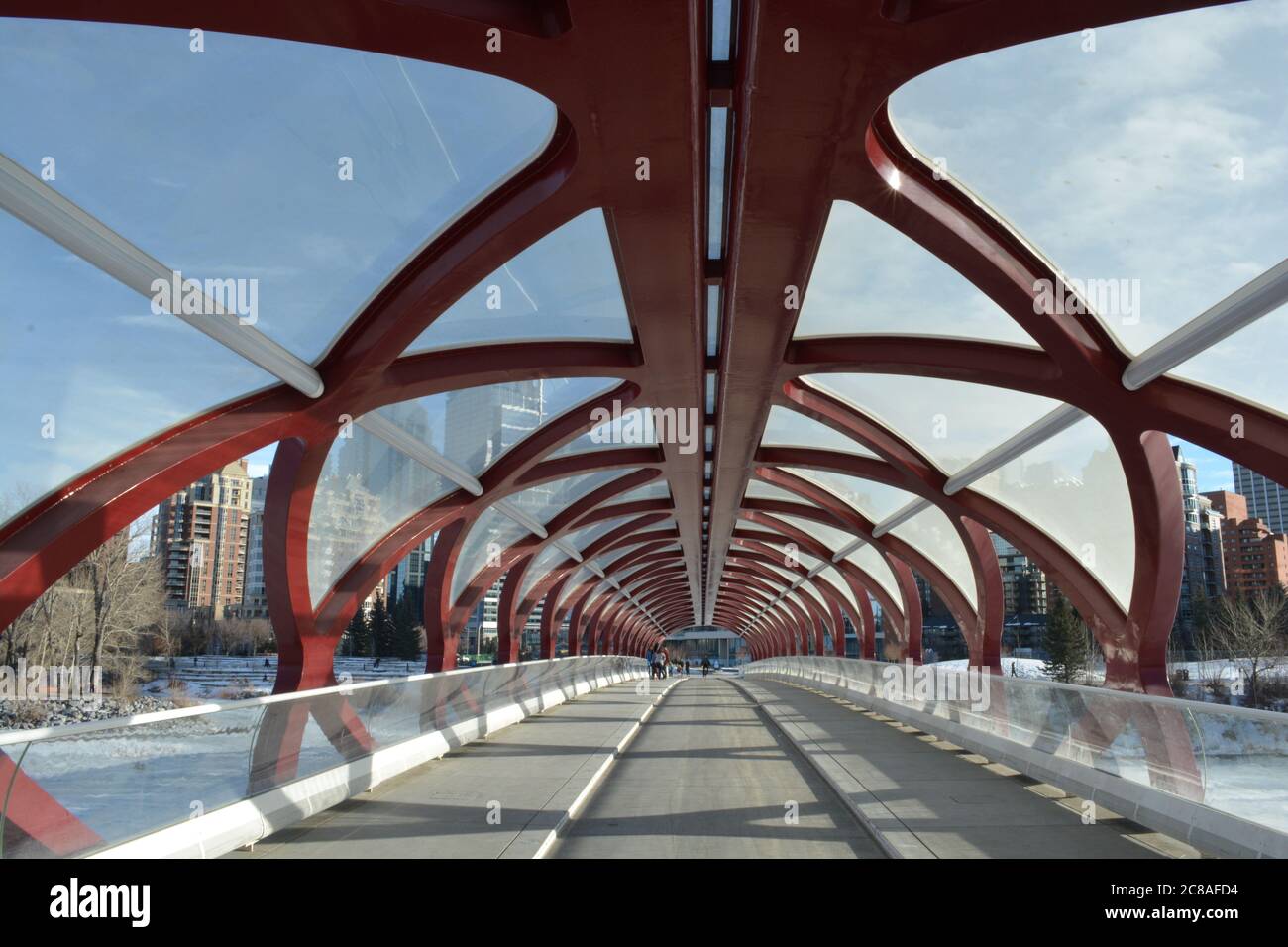 Modern Pedestrian Bridge Across River To Downtown Stock Photo - Alamy