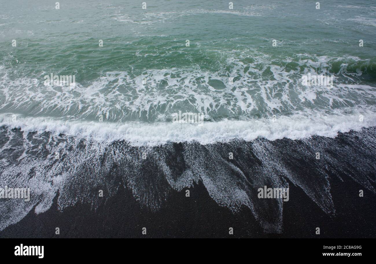 Waves lapping on the beach seen from above, Napier New Zealand Stock ...