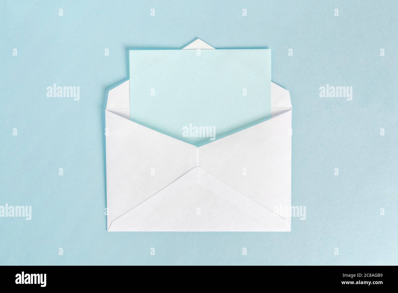 open envelope with cyan paper Stock Photo - Alamy