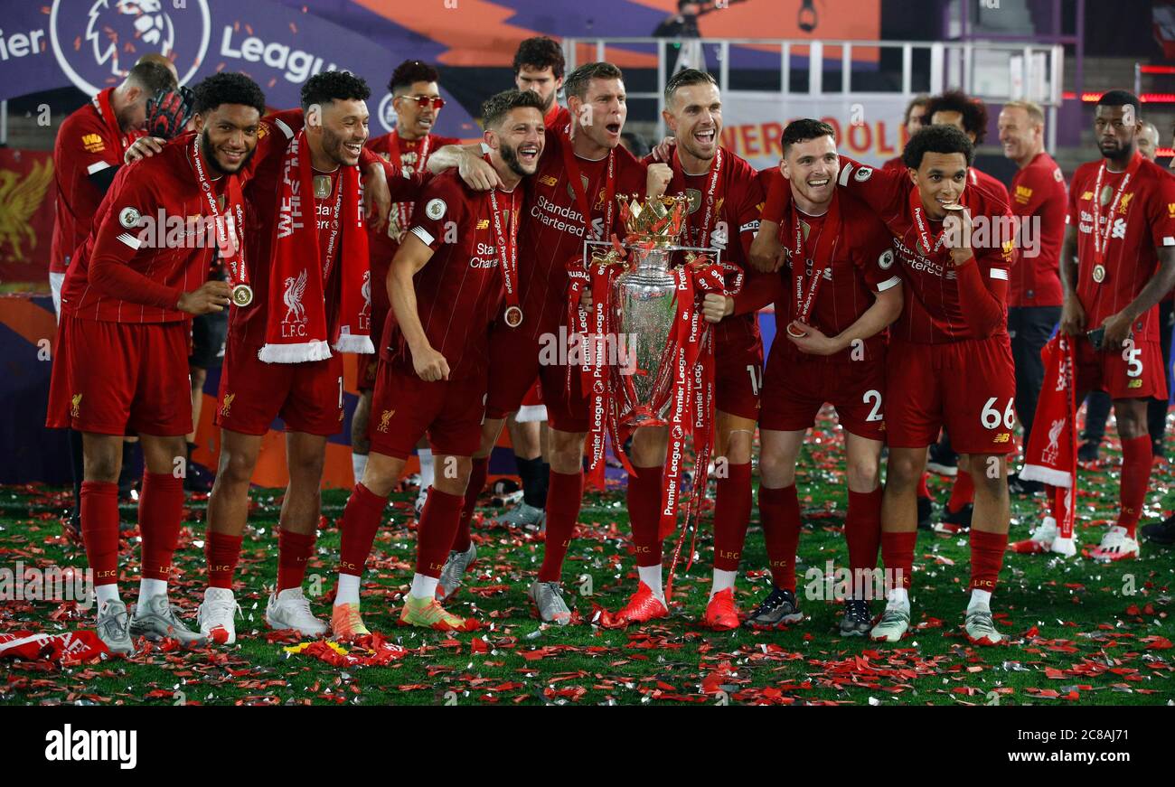 Liverpool celebrate with the Premier League trophy after the Premier ...