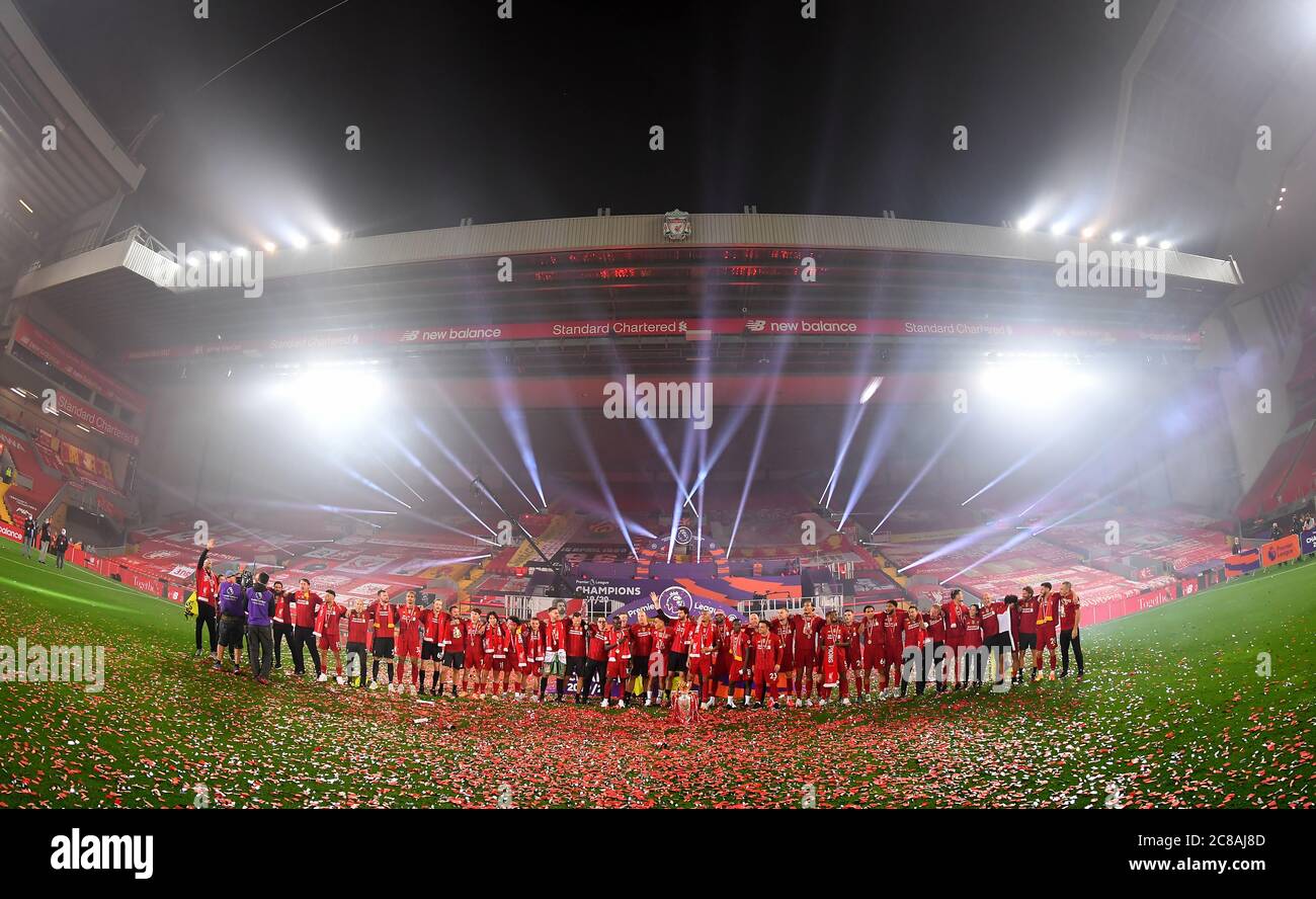 Liverpool players celebrate with the Premier League trophy after the ...
