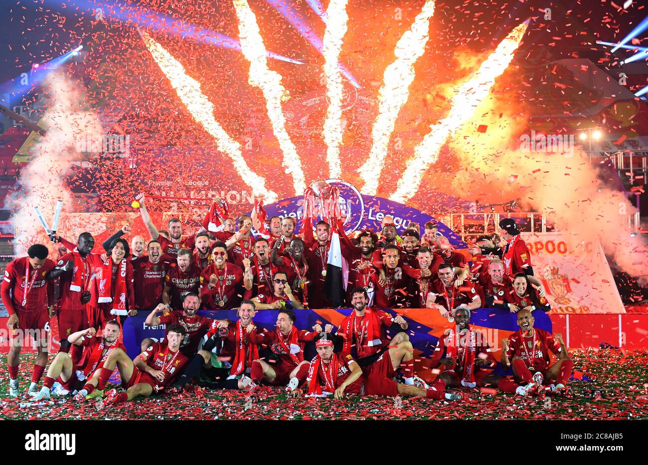 Liverpool players celebrate with the Premier League trophy after the ...