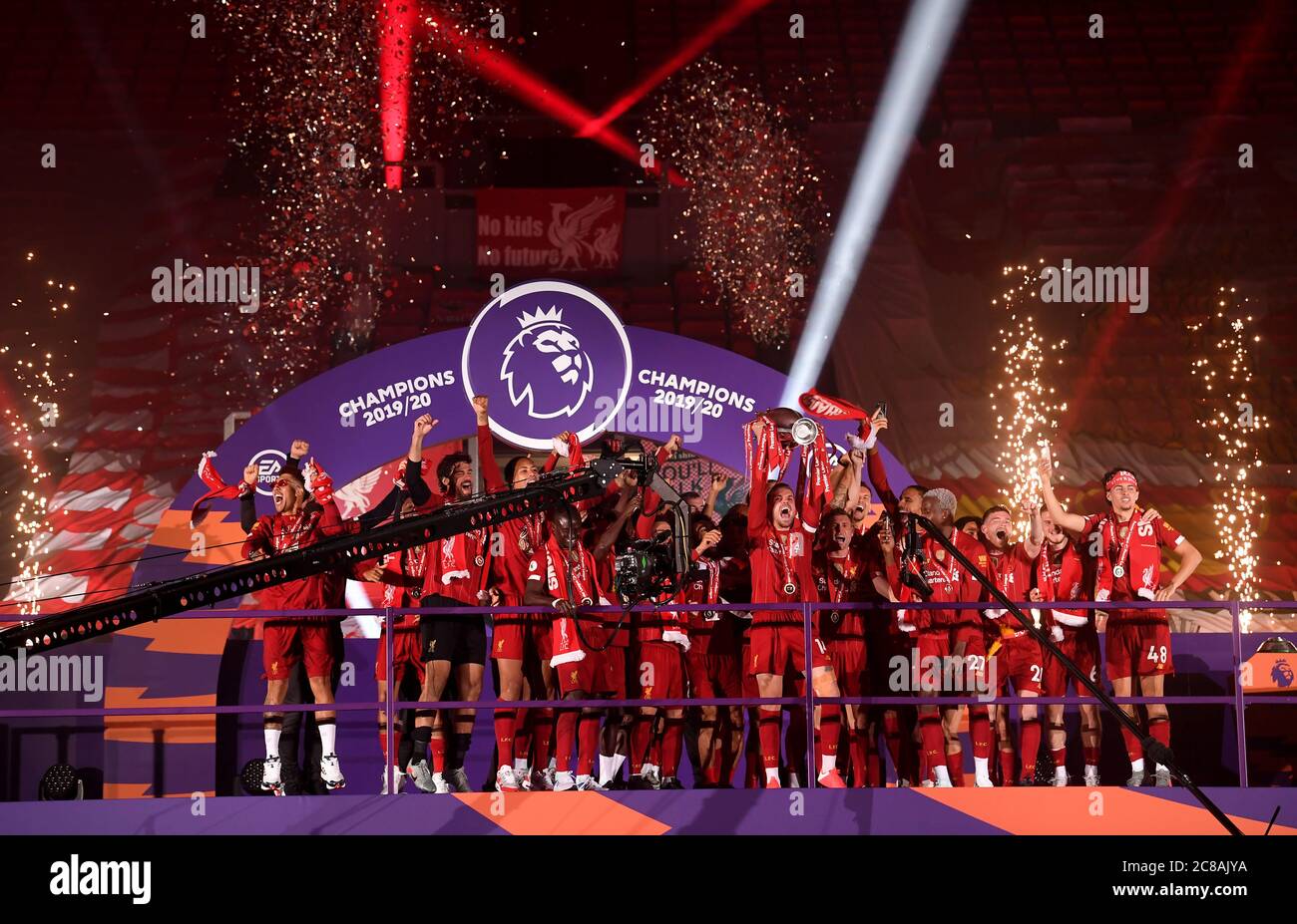 Liverpool players celebrate with the Premier League trophy after the ...
