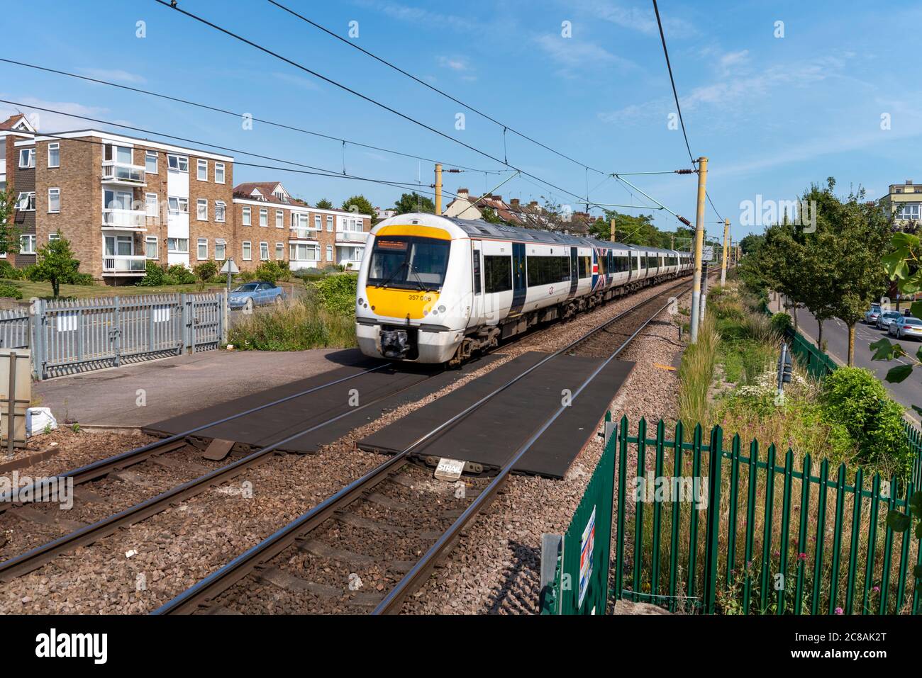 Train on level crossing hi-res stock photography and images - Alamy