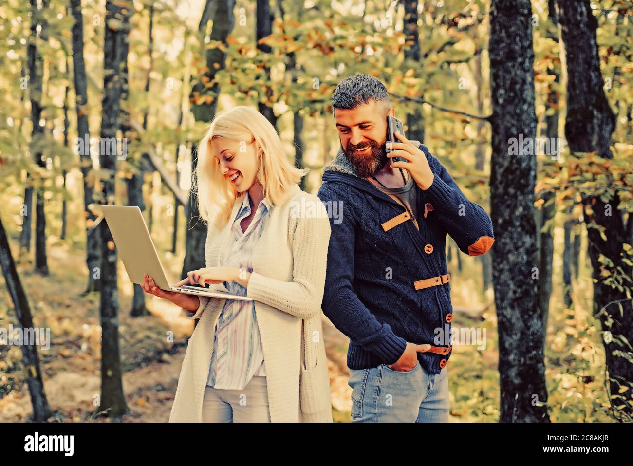 Social media concept. Business couple - man with mobile phone, woman ...
