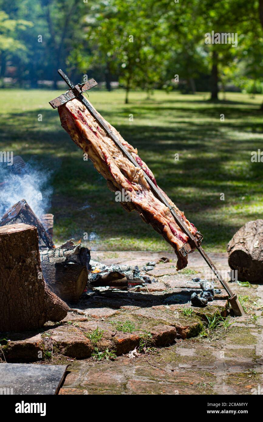 Asado, traditional barbecue dish in Argentina, roasted meat cooked on a ...