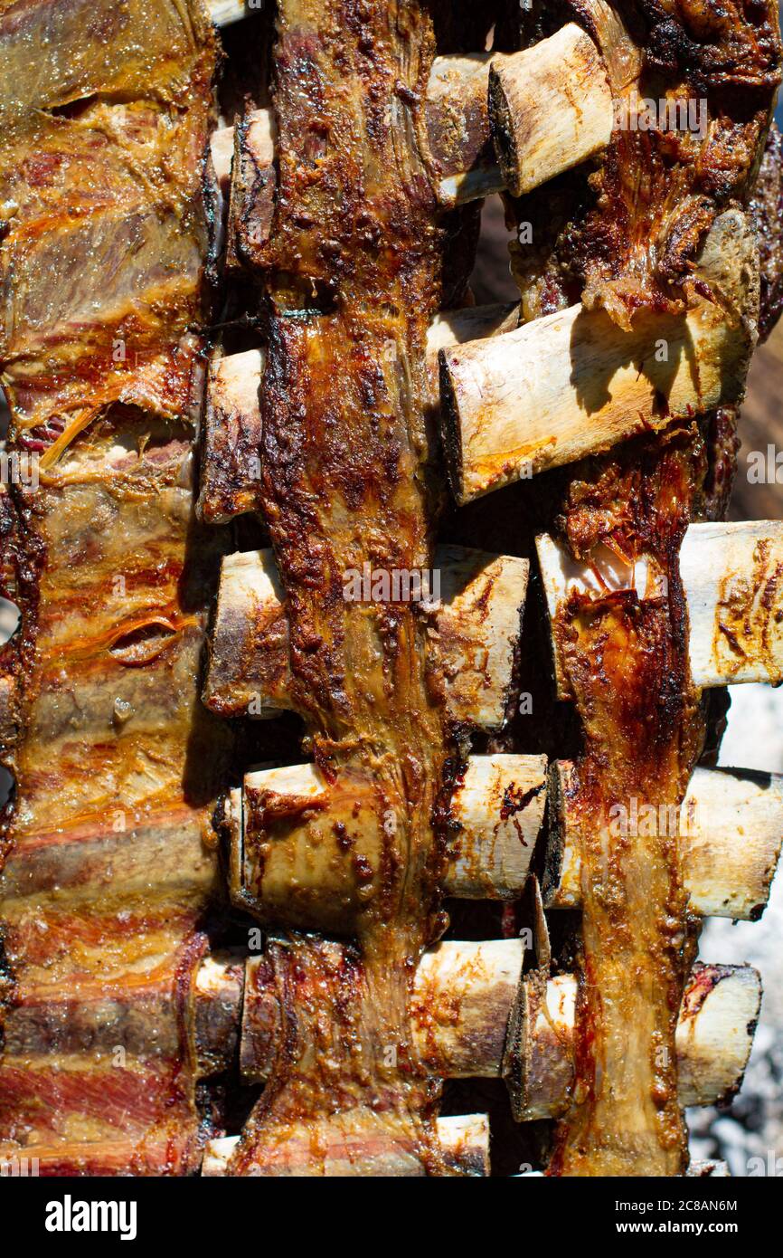Asado, traditional barbecue dish in Argentina, roasted meat cooked on a ...