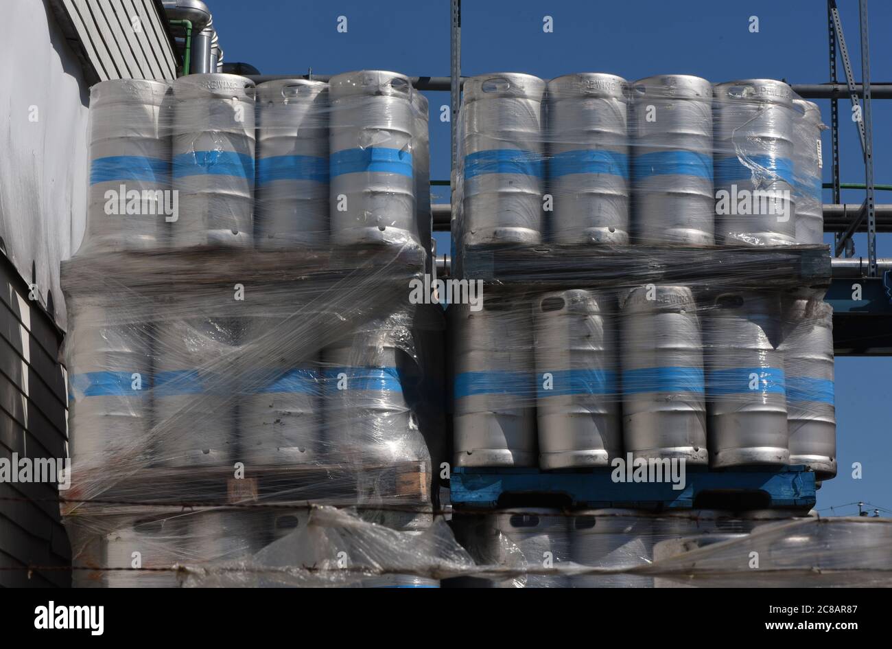 Metal beer kegs on pallets outside the Phillips Brewing and Malting Co ...