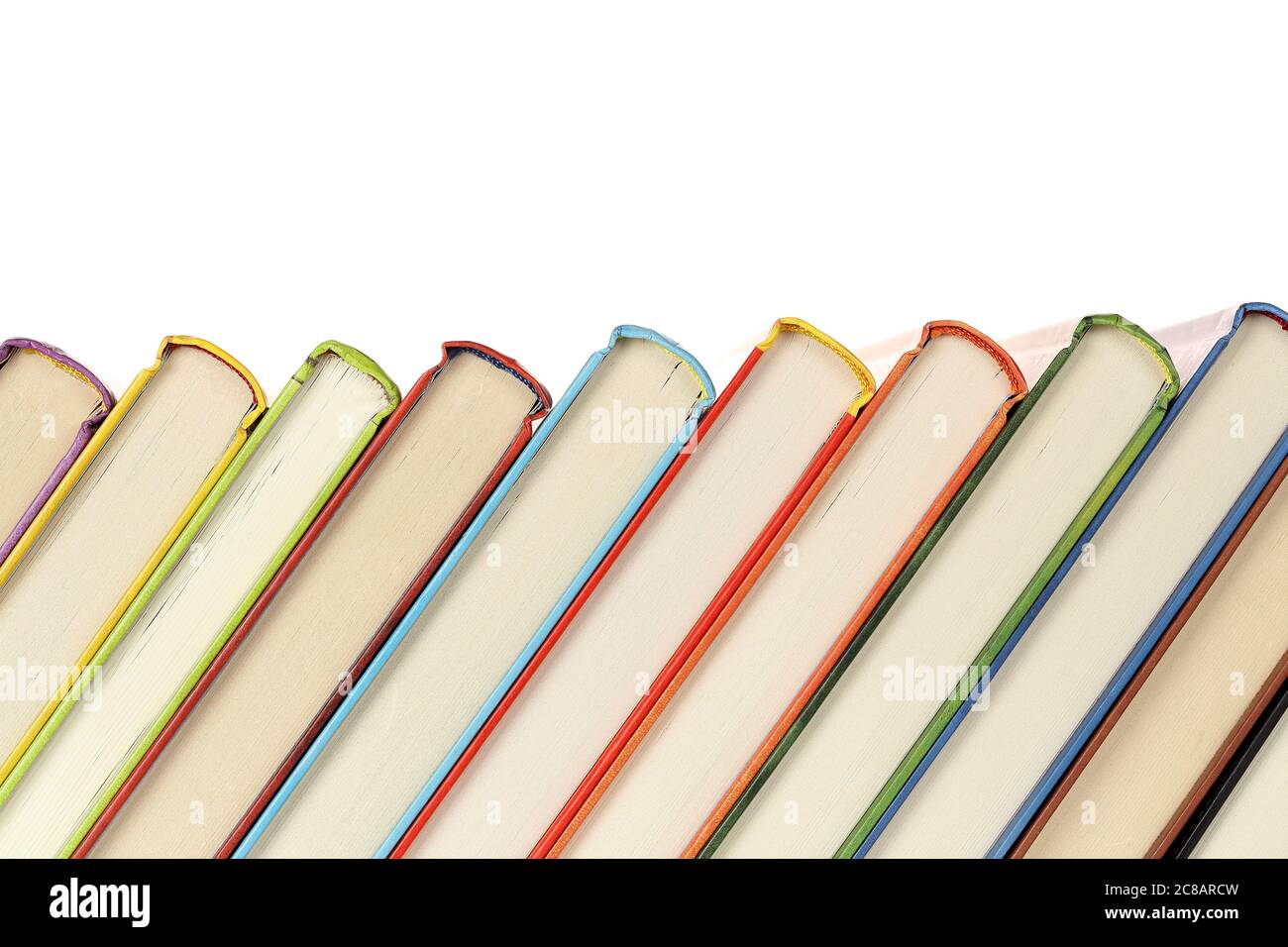 row of colorful and slanted books isolated on white Stock Photo - Alamy