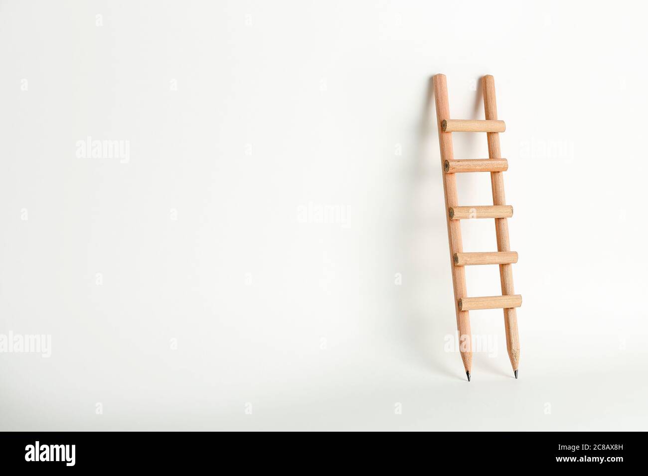 pencil ladder on white with copy space, education concept Stock Photo ...