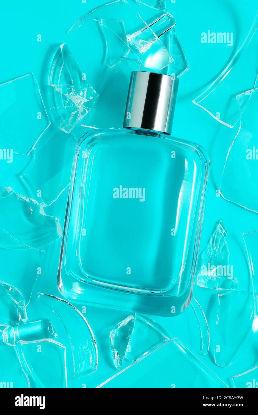 perfume bottle with broken glass on pink Stock Photo - Alamy