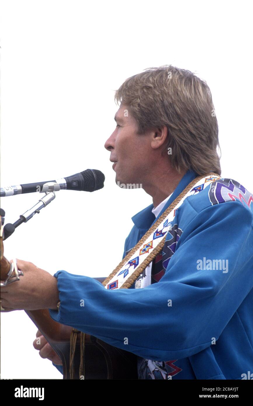 Singer John Denver performs at an Earth Day rally at the United States ...