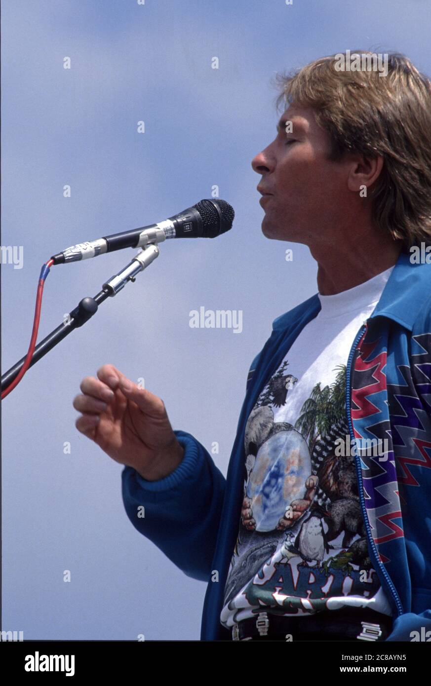 Singer John Denver performs at an Earth Day rally at the United States ...