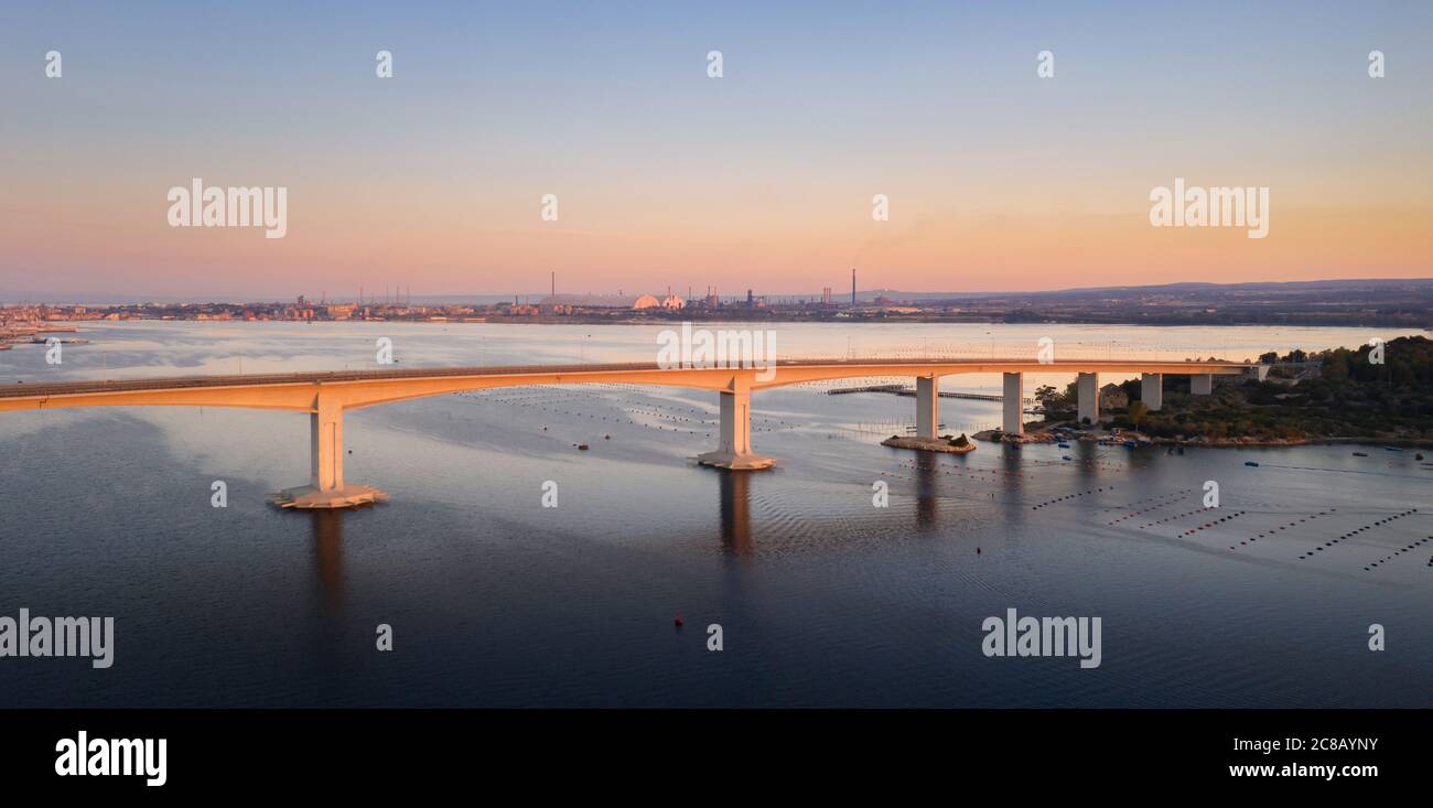 The bridge "Punta Penna" of Taranto at sunrise Stock Photo - Alamy