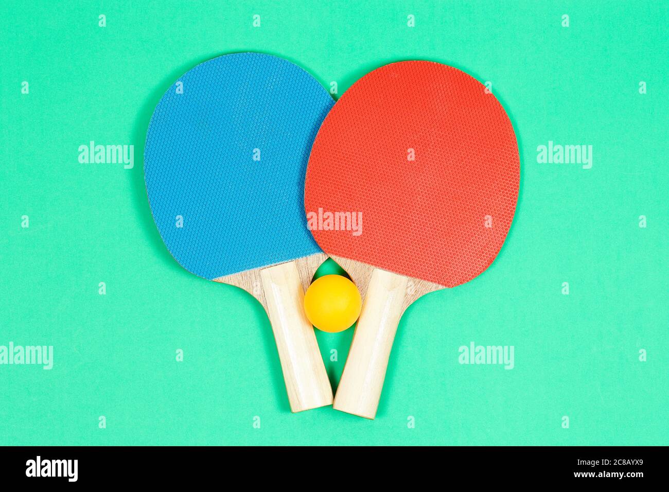 top view of ping pong rackets on green surface Stock Photo - Alamy