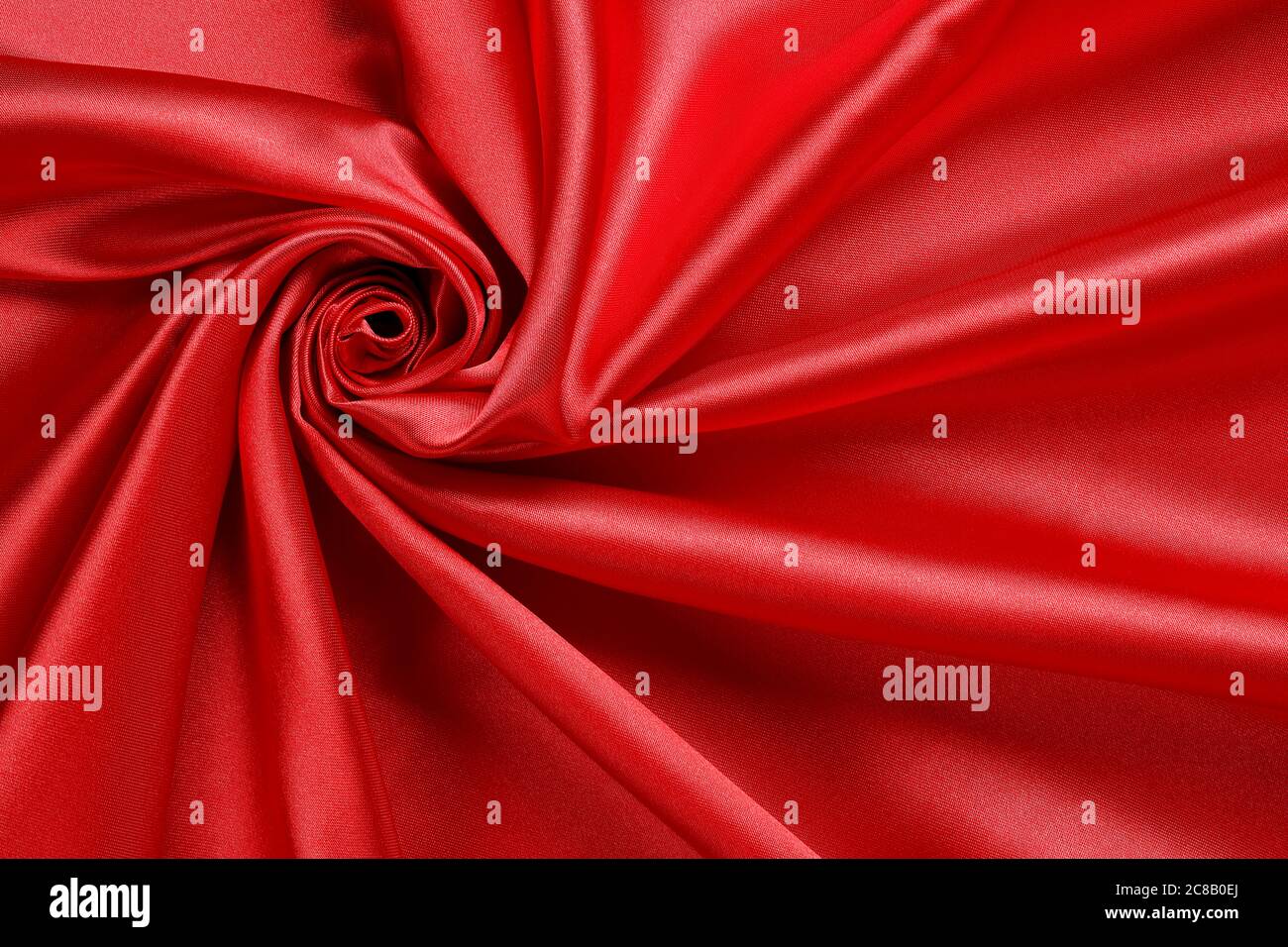 luxurious red satin fabric, abstract swirls and folds Stock Photo - Alamy