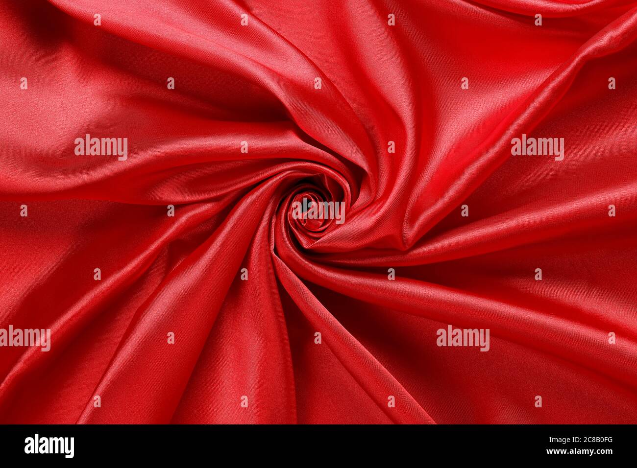 luxurious red satin fabric, abstract swirls and folds Stock Photo - Alamy