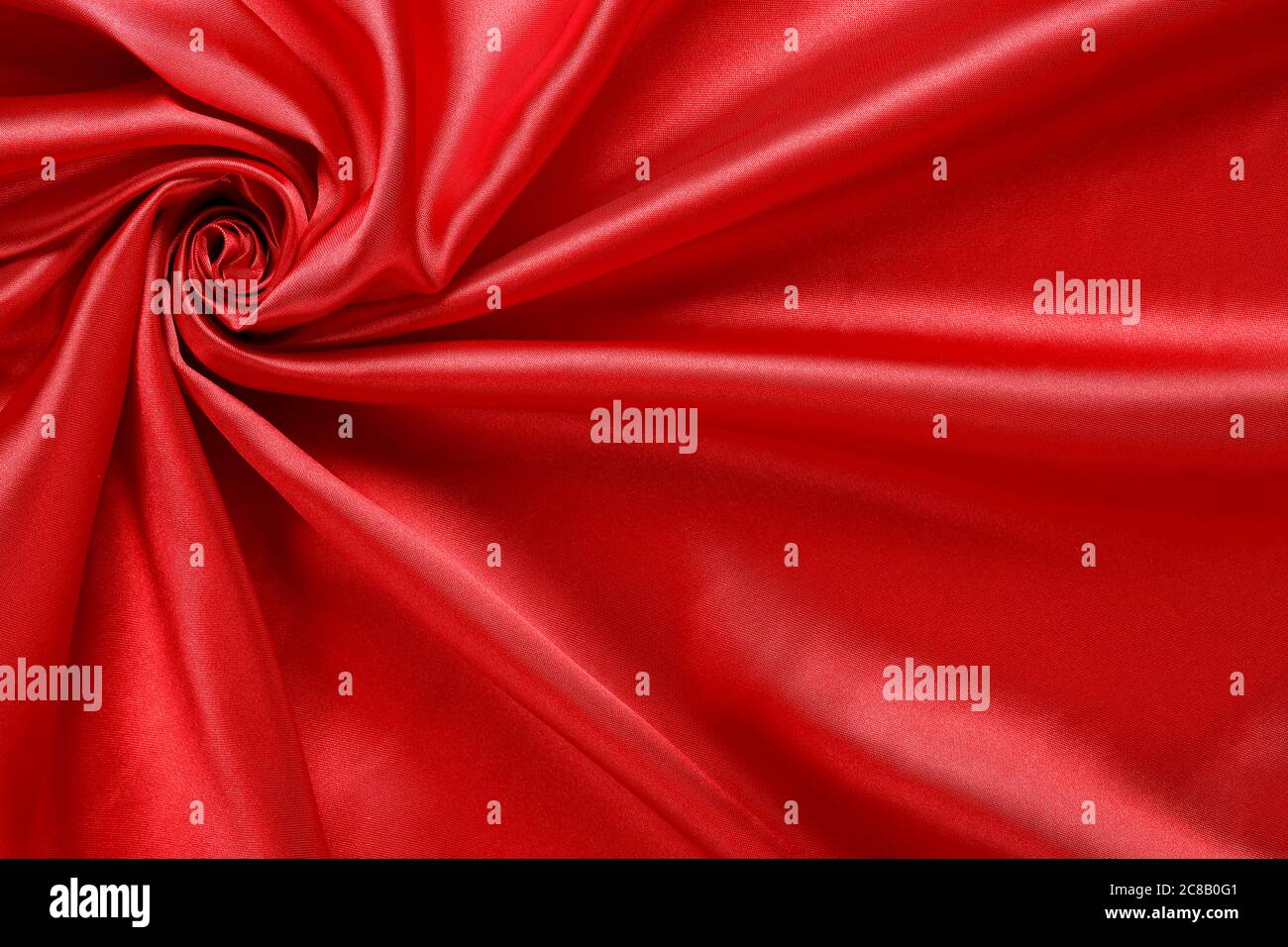 luxurious red satin fabric, abstract swirls and folds Stock Photo - Alamy