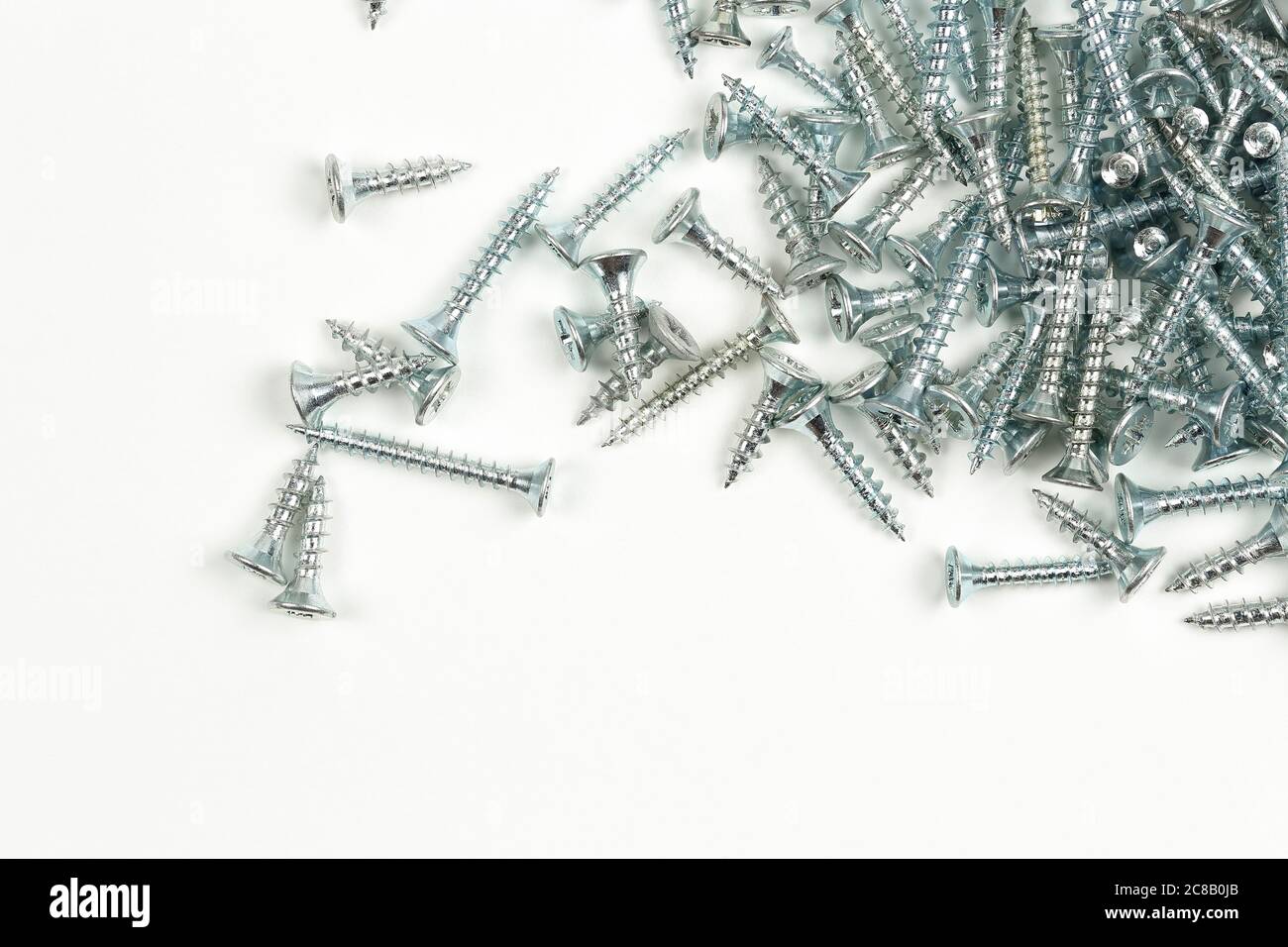 number of screws on white paper texture Stock Photo - Alamy
