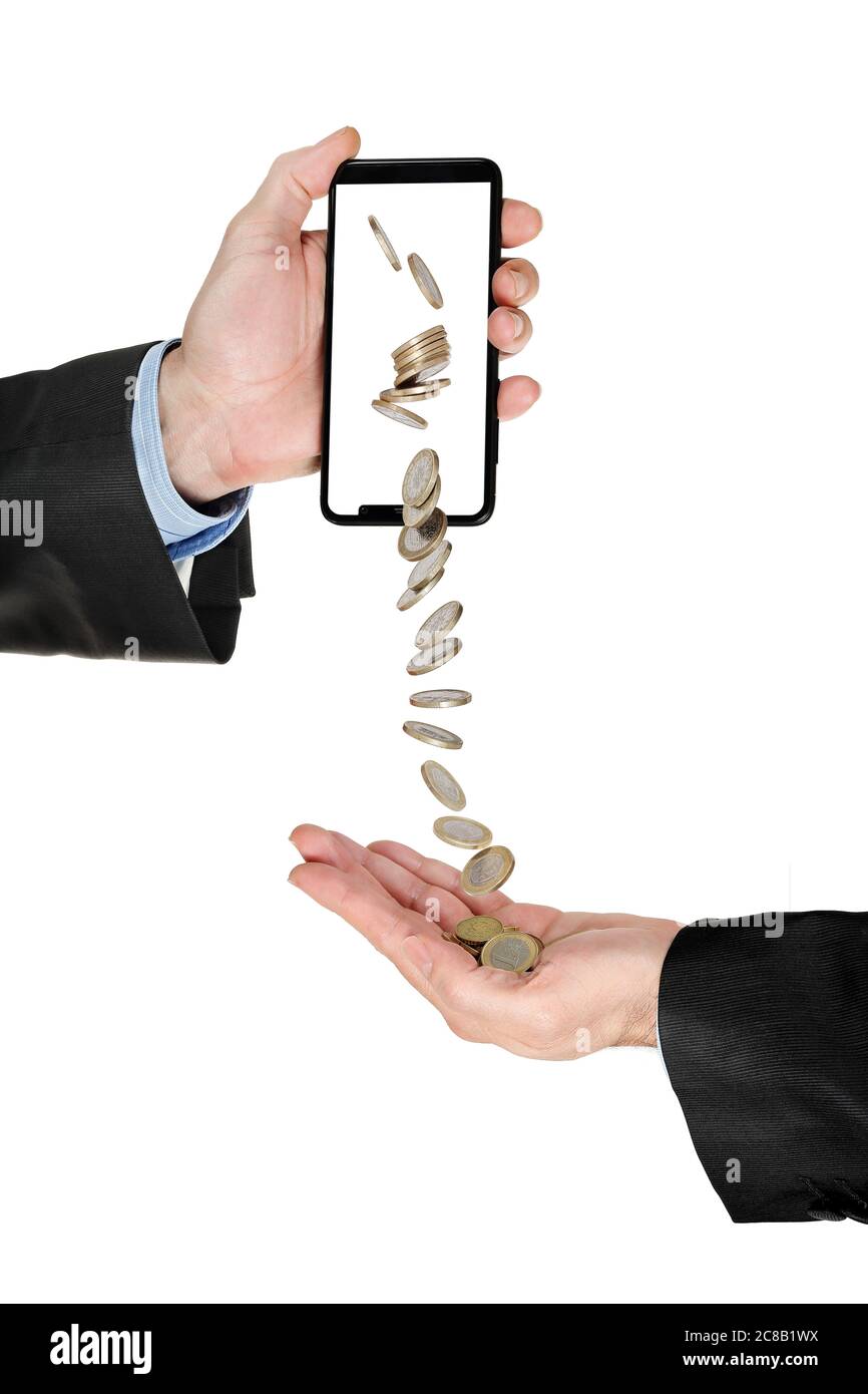 coins falling from smart phone into open hand, smart payment concept ...