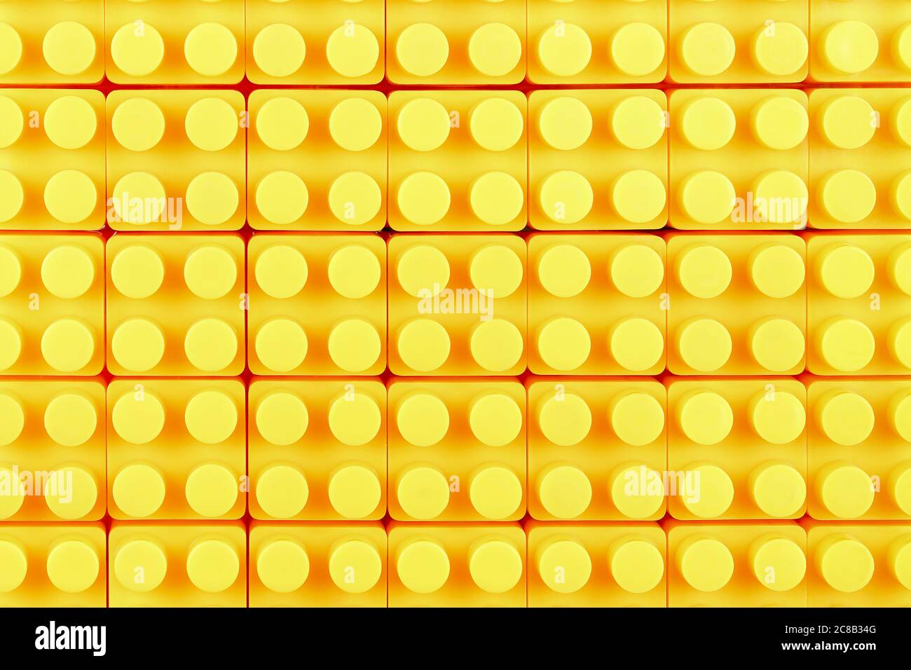 surface of yellow toy blocks Stock Photo - Alamy