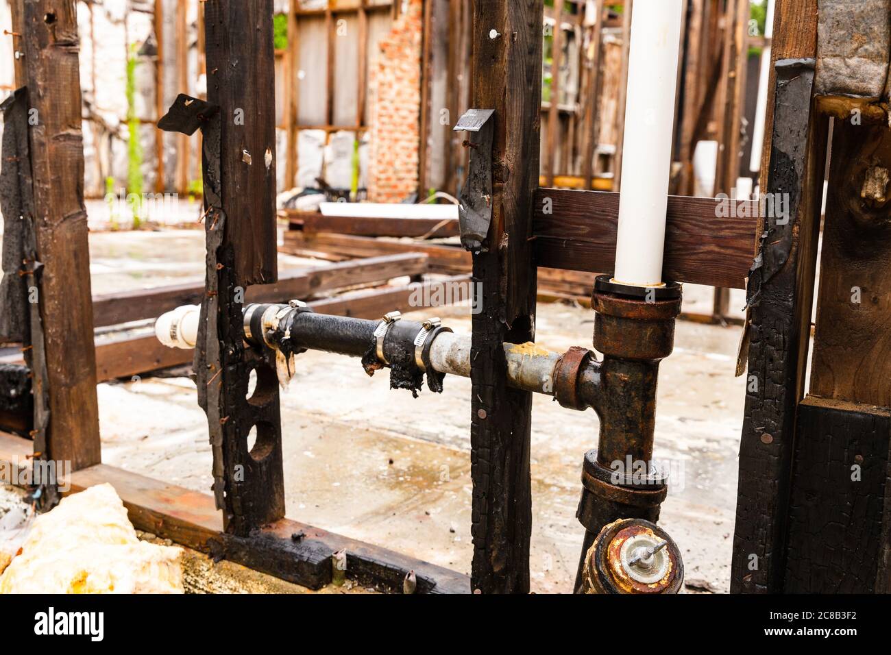 Burned remains of house after fire Stock Photo - Alamy