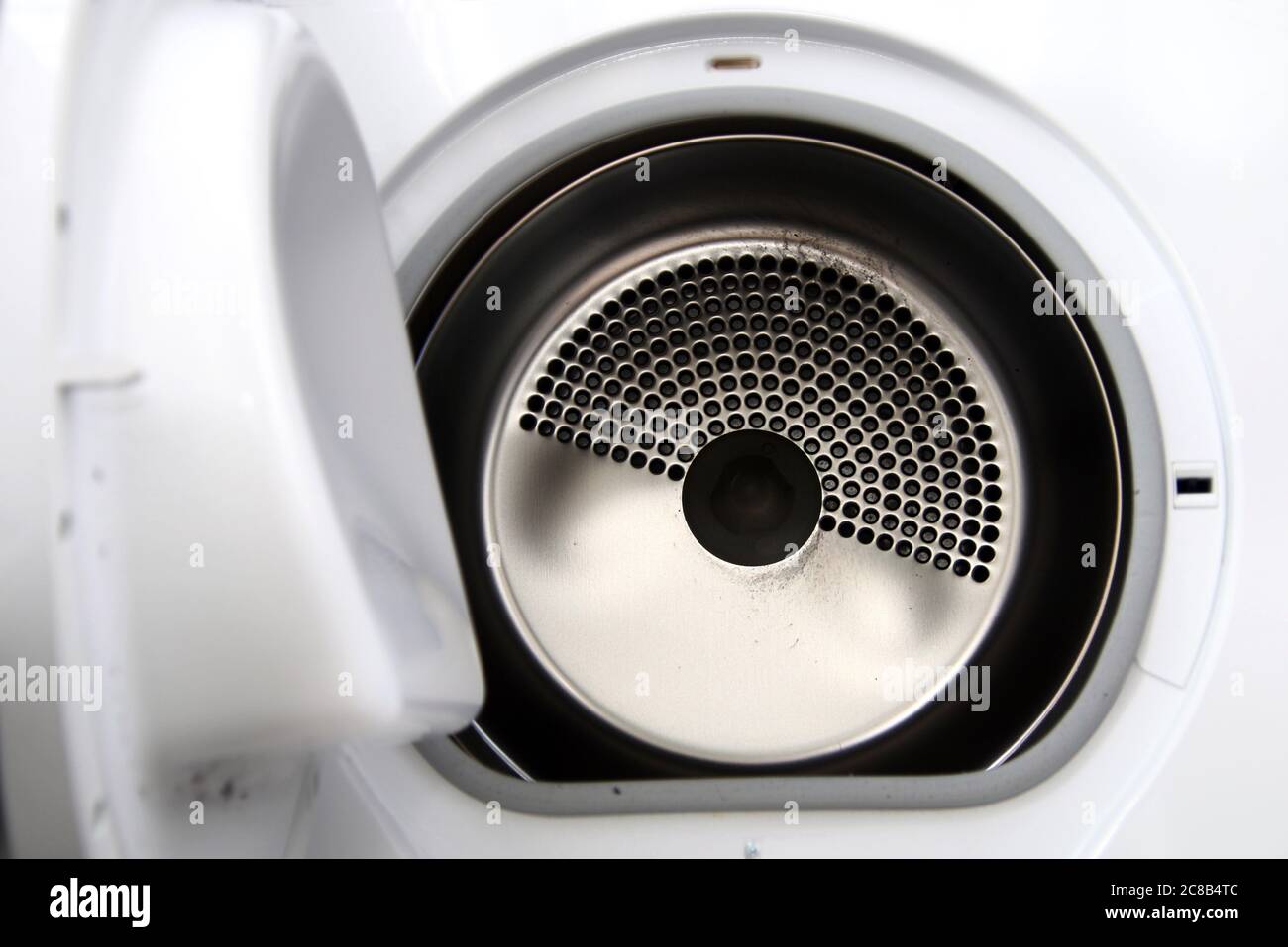 open front load dryer interior view in close up Stock Photo - Alamy