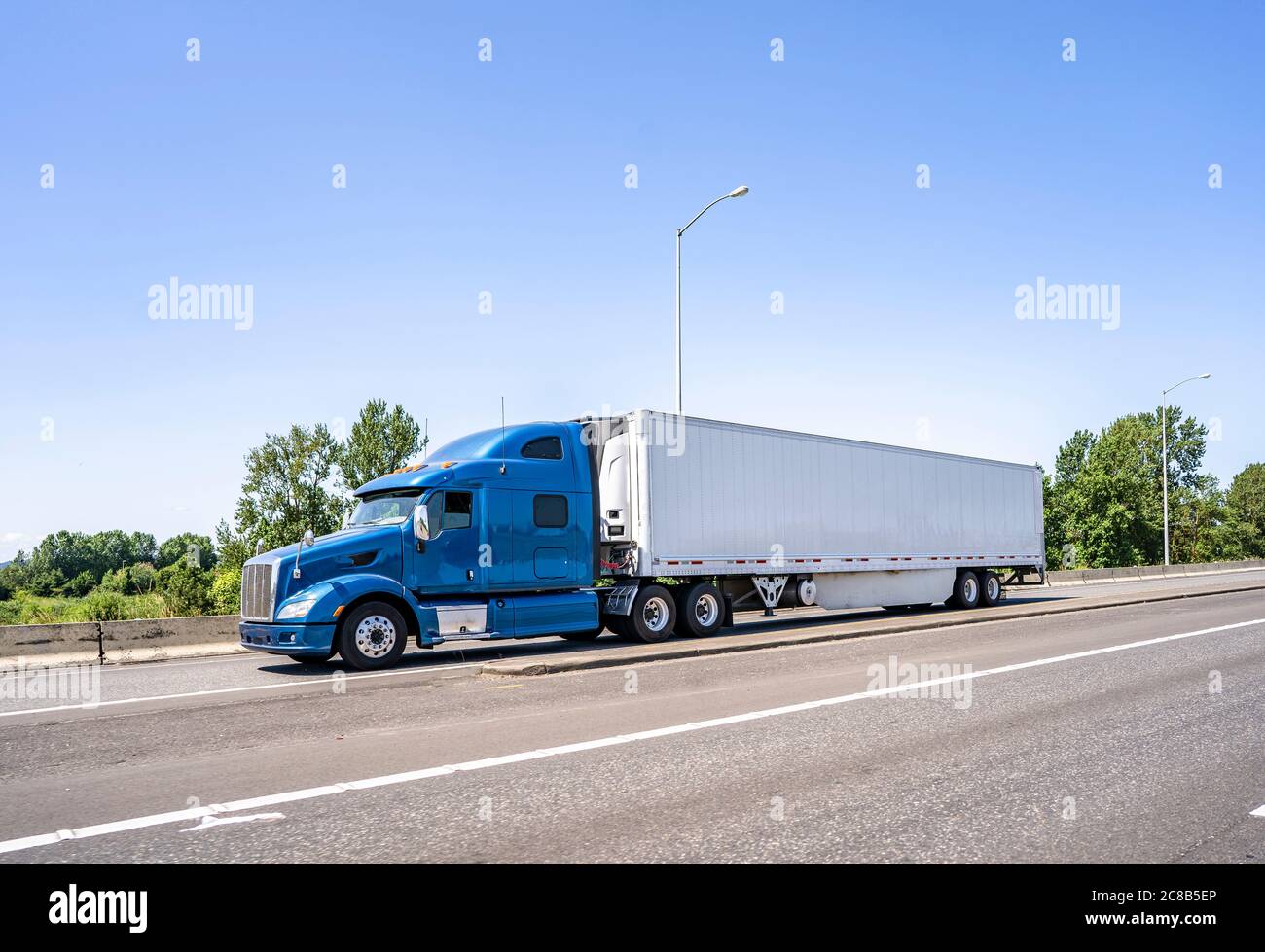 Big rig blue bonnet semi truck with high cab and long refrigerator semi ...