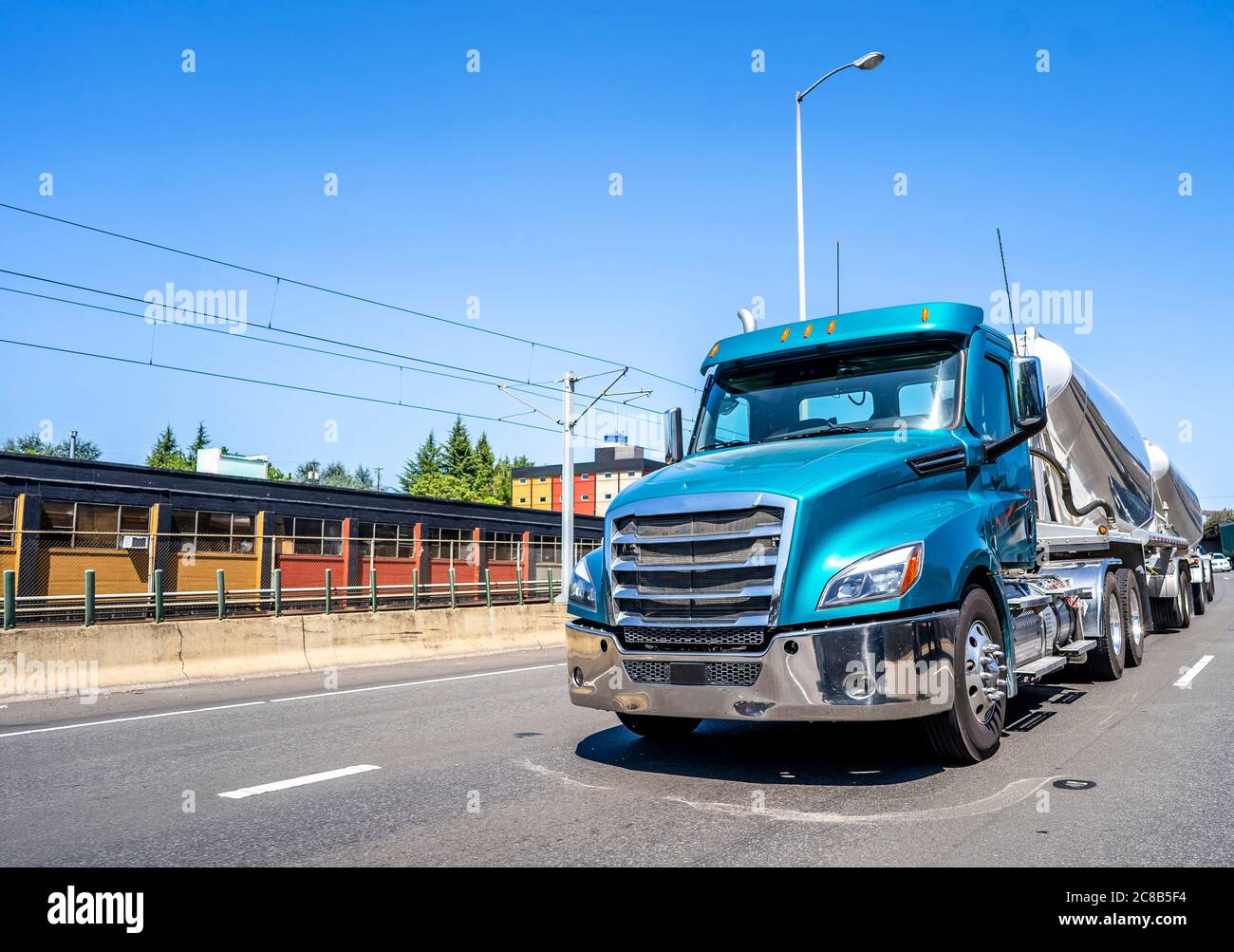 Big rig blue shiny industrial diesel day cab powerful semi truck ...