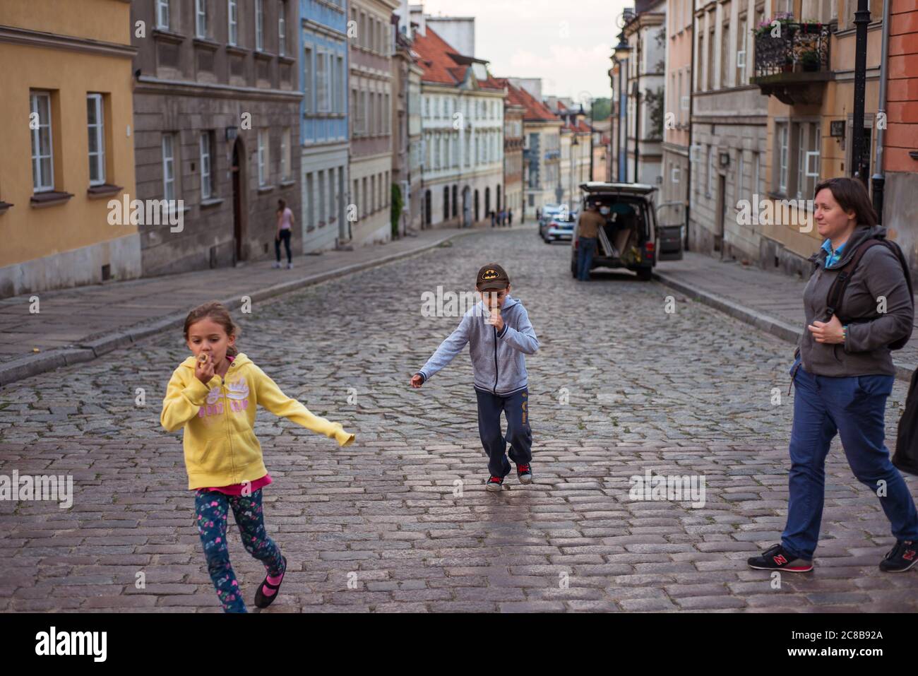 Warsaw / Poland - June 10, 2019: two children playing on cobblestone ...
