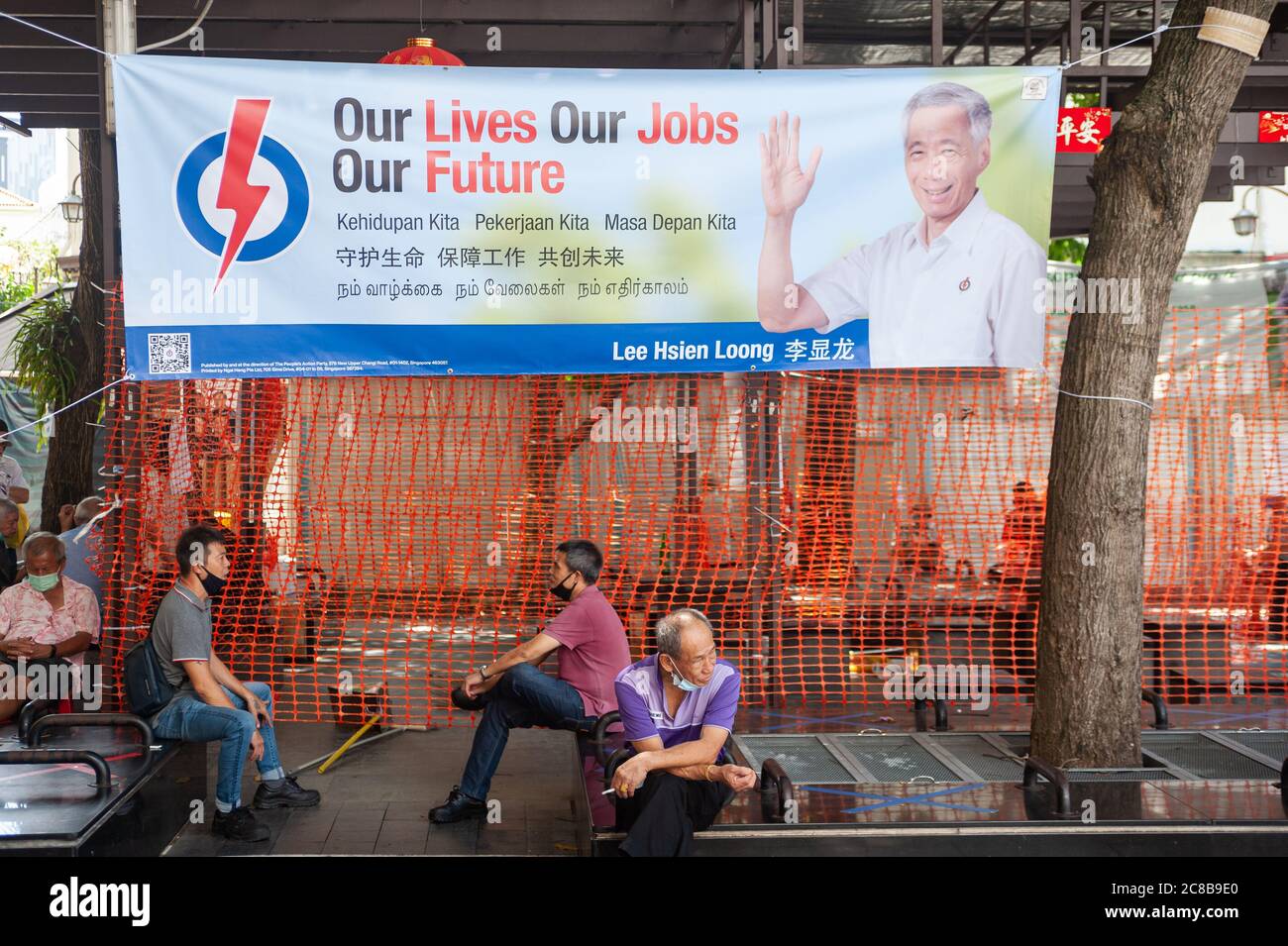 06.07.2020, Singapore, Republic of Singapore, Asia - Men sit at the ...
