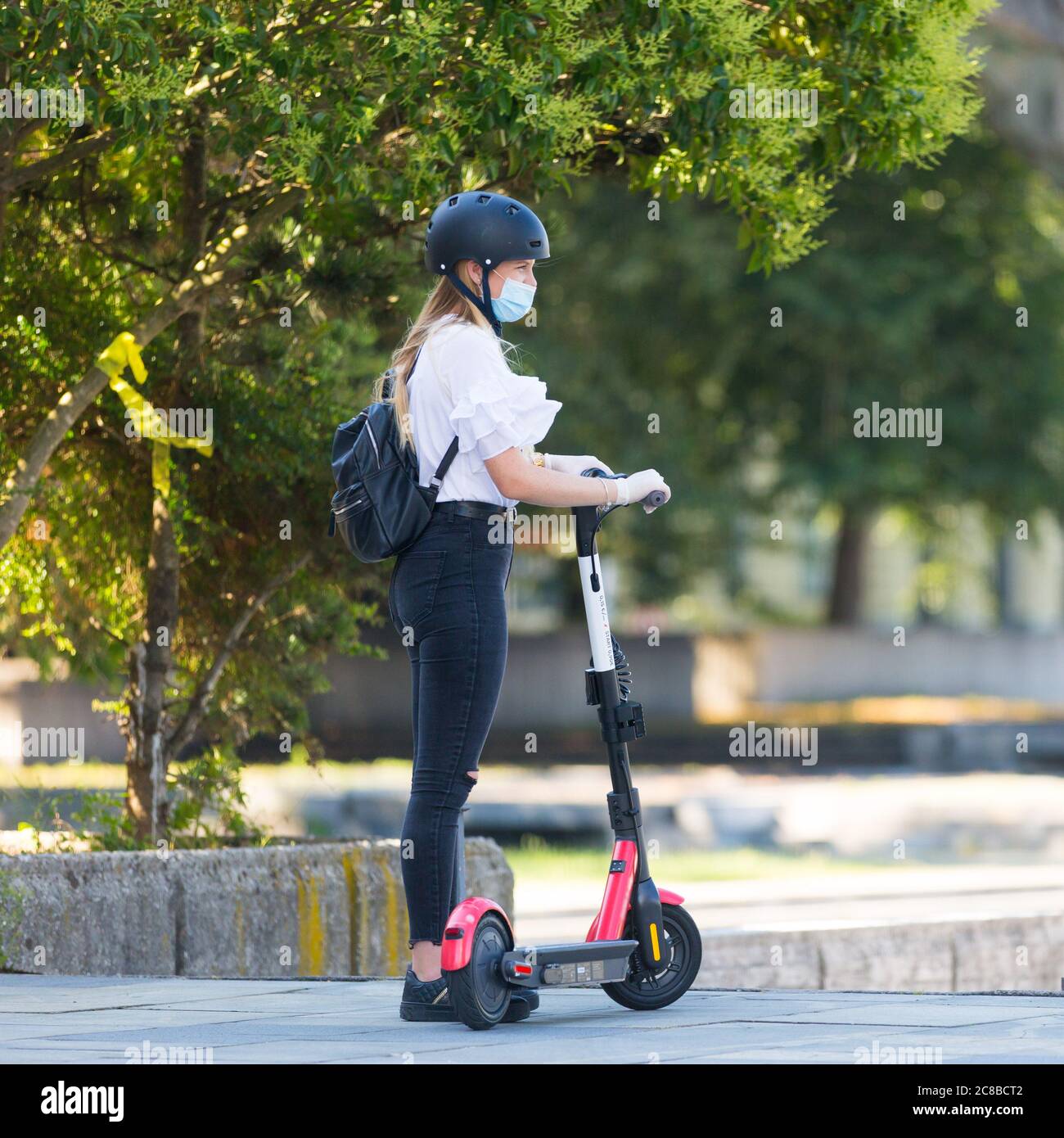 Using electric scooters hi-res stock photography and images - Alamy
