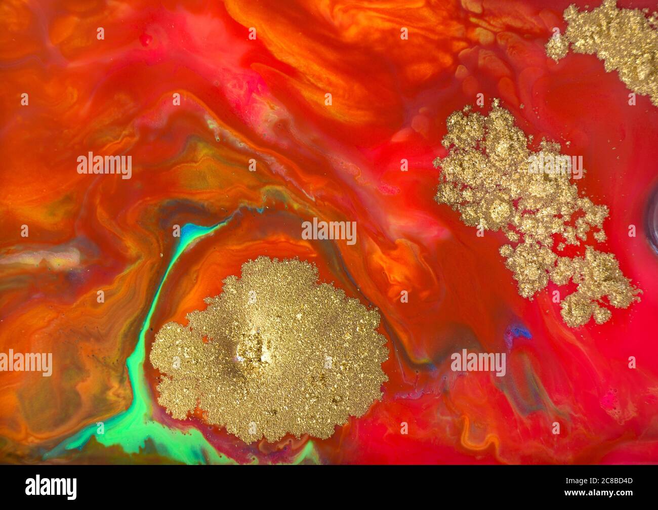 Red and green fluid pattern with small gold particles Stock Photo - Alamy