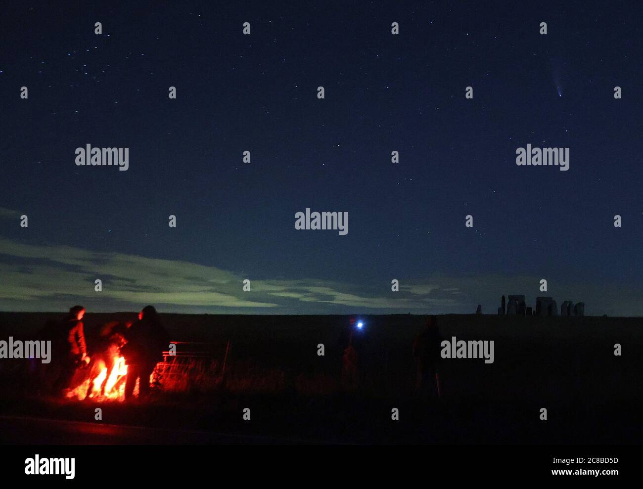 Stargazers observe Comet Neowise in the night sky over Stonehenge in ...