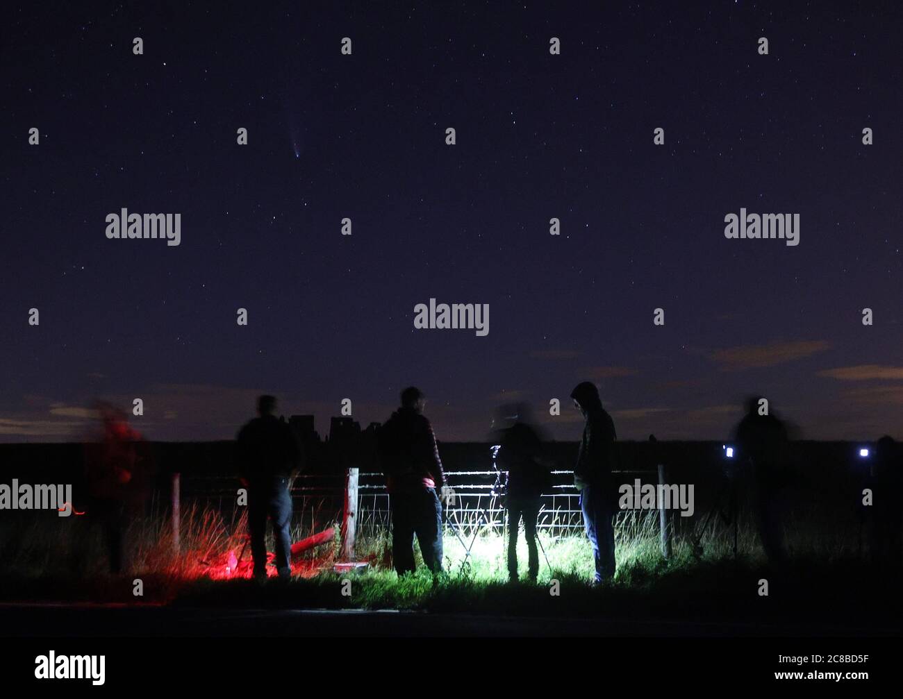 Stargazers observe Comet Neowise appearing in the night sky over ...