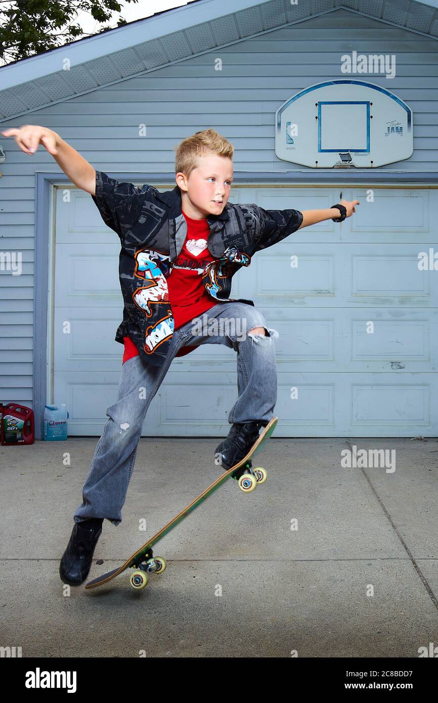 Blond boy's skateboarding stunts will leave you in awe Stock Photo - Alamy