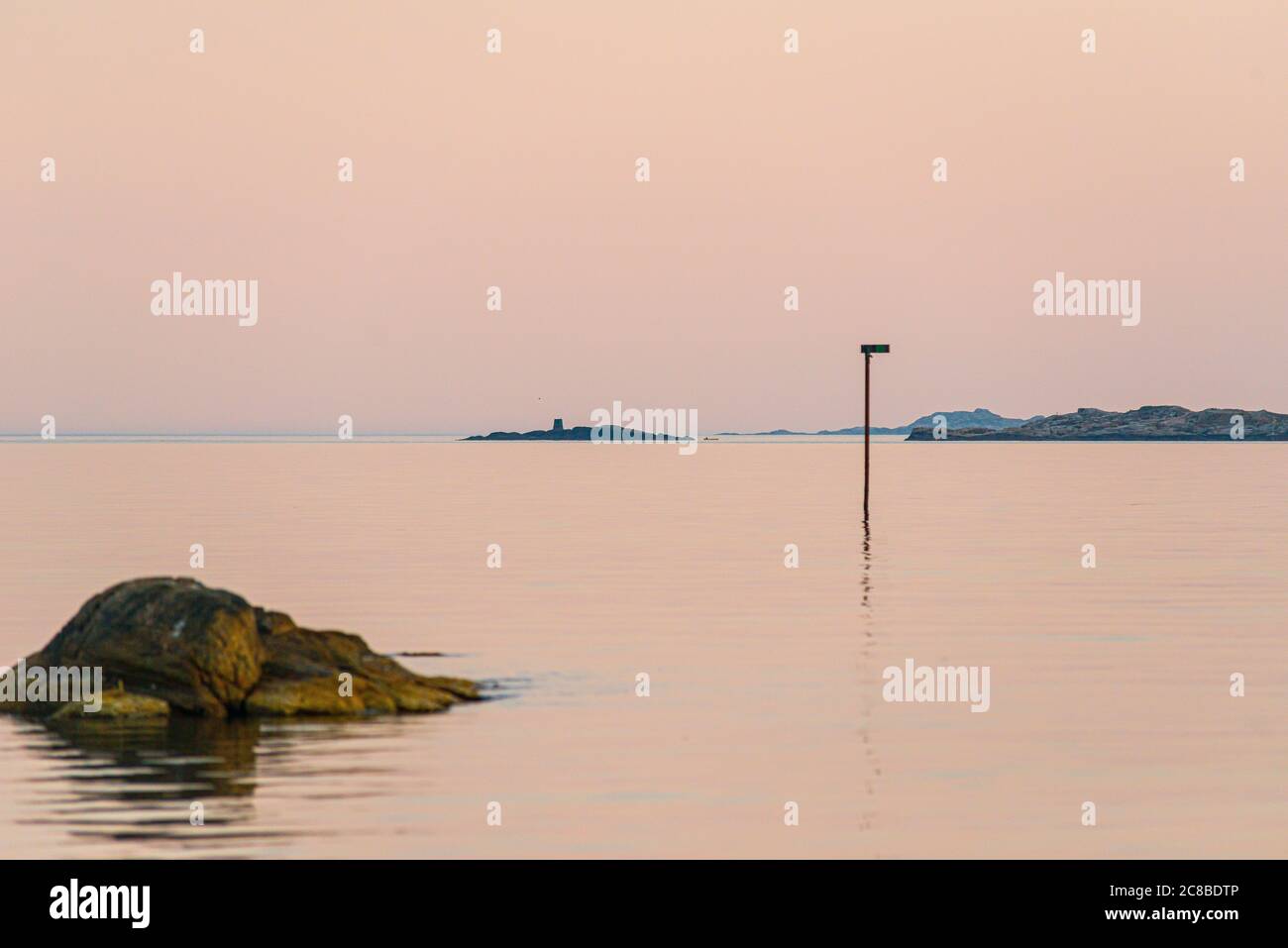 Old navigational mark on a quiet summer night Stock Photo - Alamy