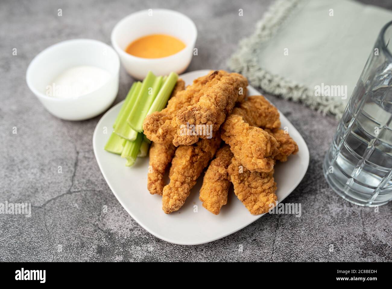 Chicken Fingers dinner, breaded crispy tenders with celery Stock Photo ...
